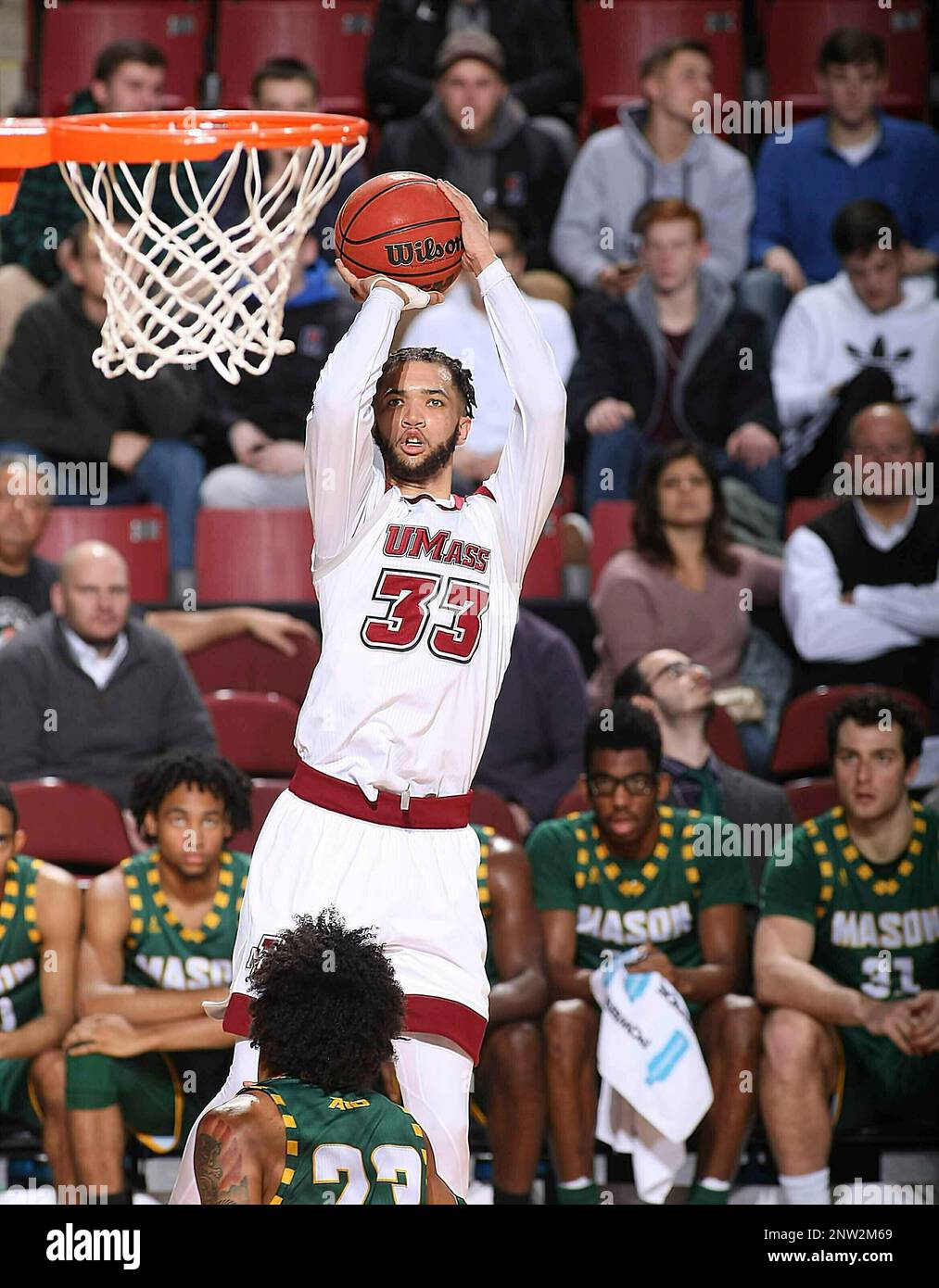 Massachusetts' Curtis Cobb (33) shoots over George Mason's Javon Greene ...