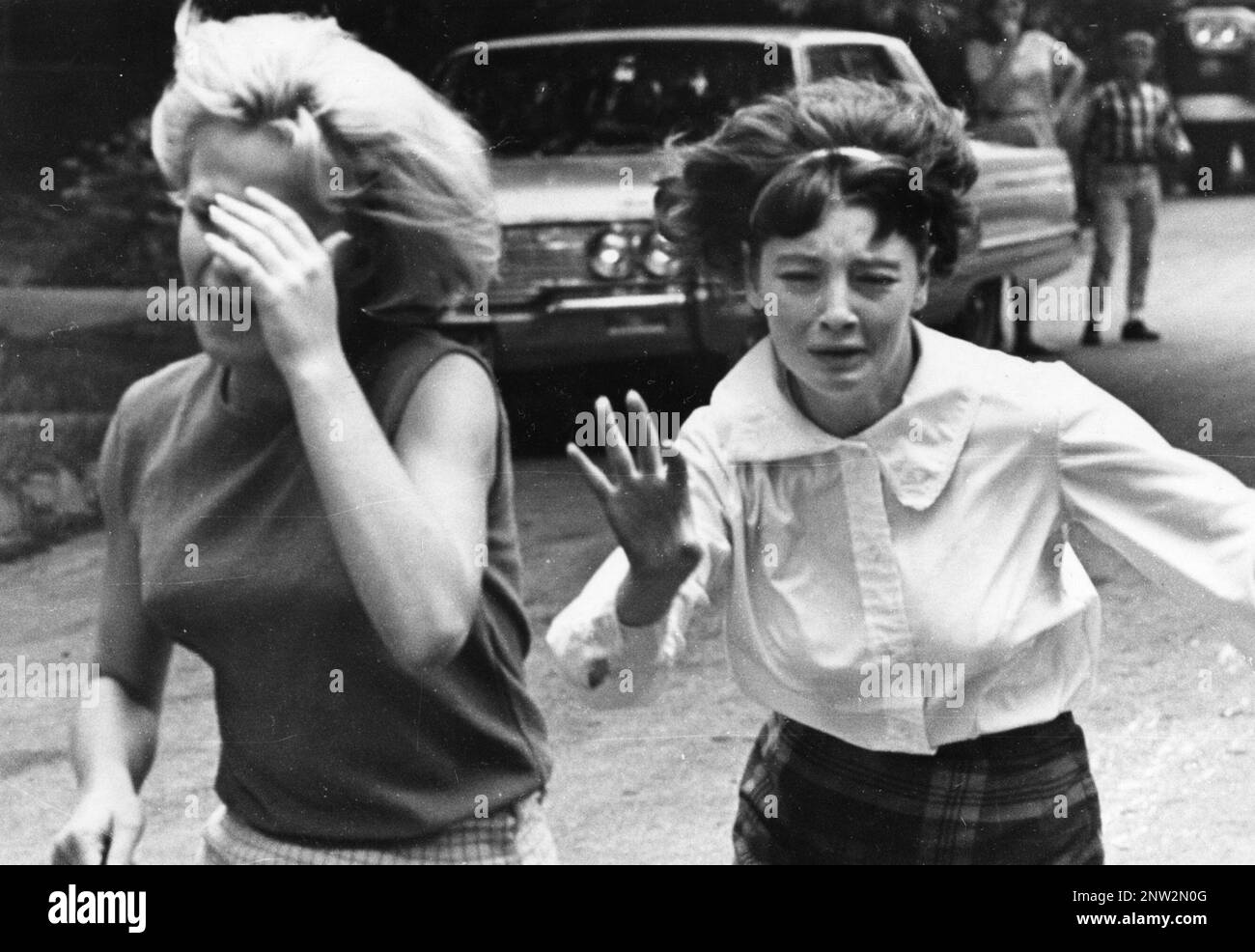 Two girls flee in horror after an explosion rocked the Hapeville Day ...