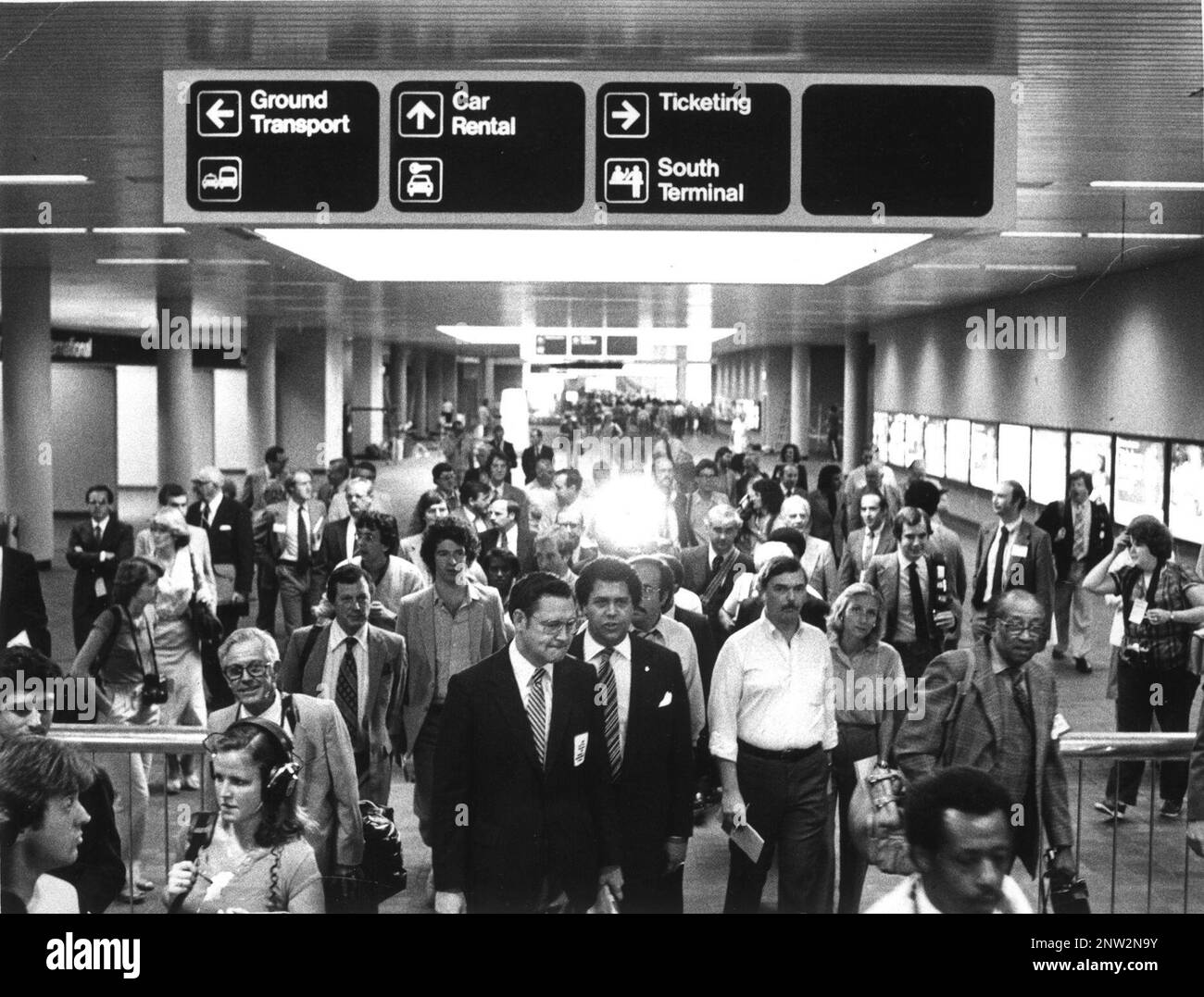 Airport Commissioner George Berry and Mayor Maynard Jackson lead a ...