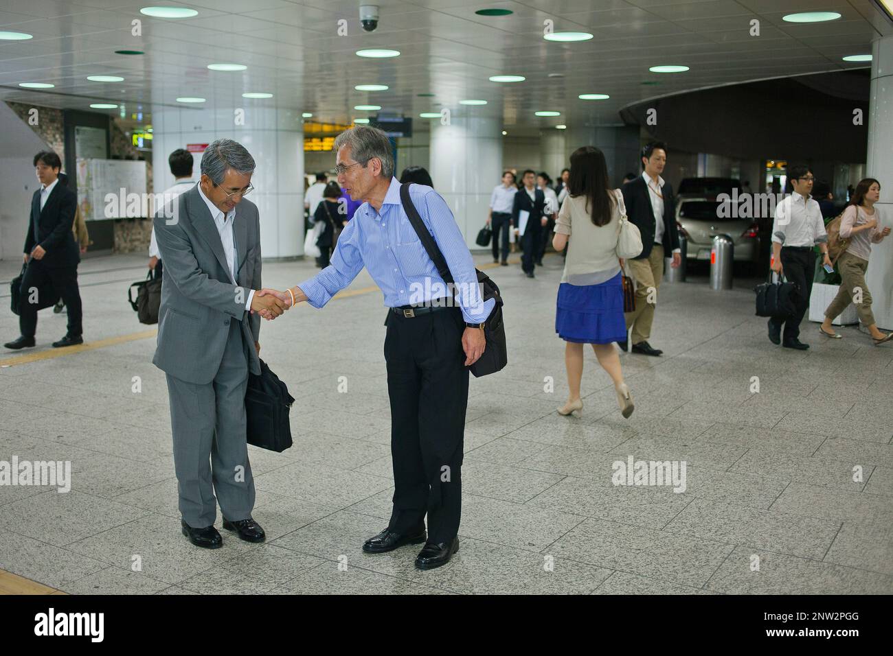 Two men say goodbye in Shinjuku station.Shinjuku.Tokyo city, Japan ...