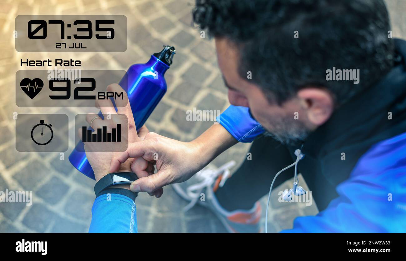 Man running in the park. Healthy runner with smart fit watch ...