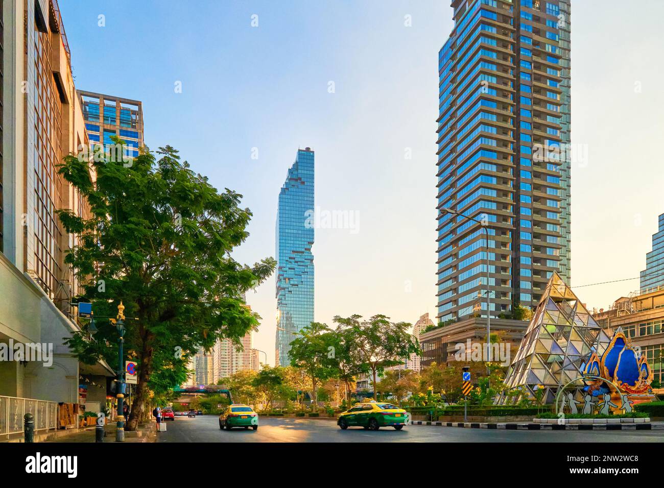 Street in Bangkok, Thailand, high-rises, trees, sunlight, evening Stock ...