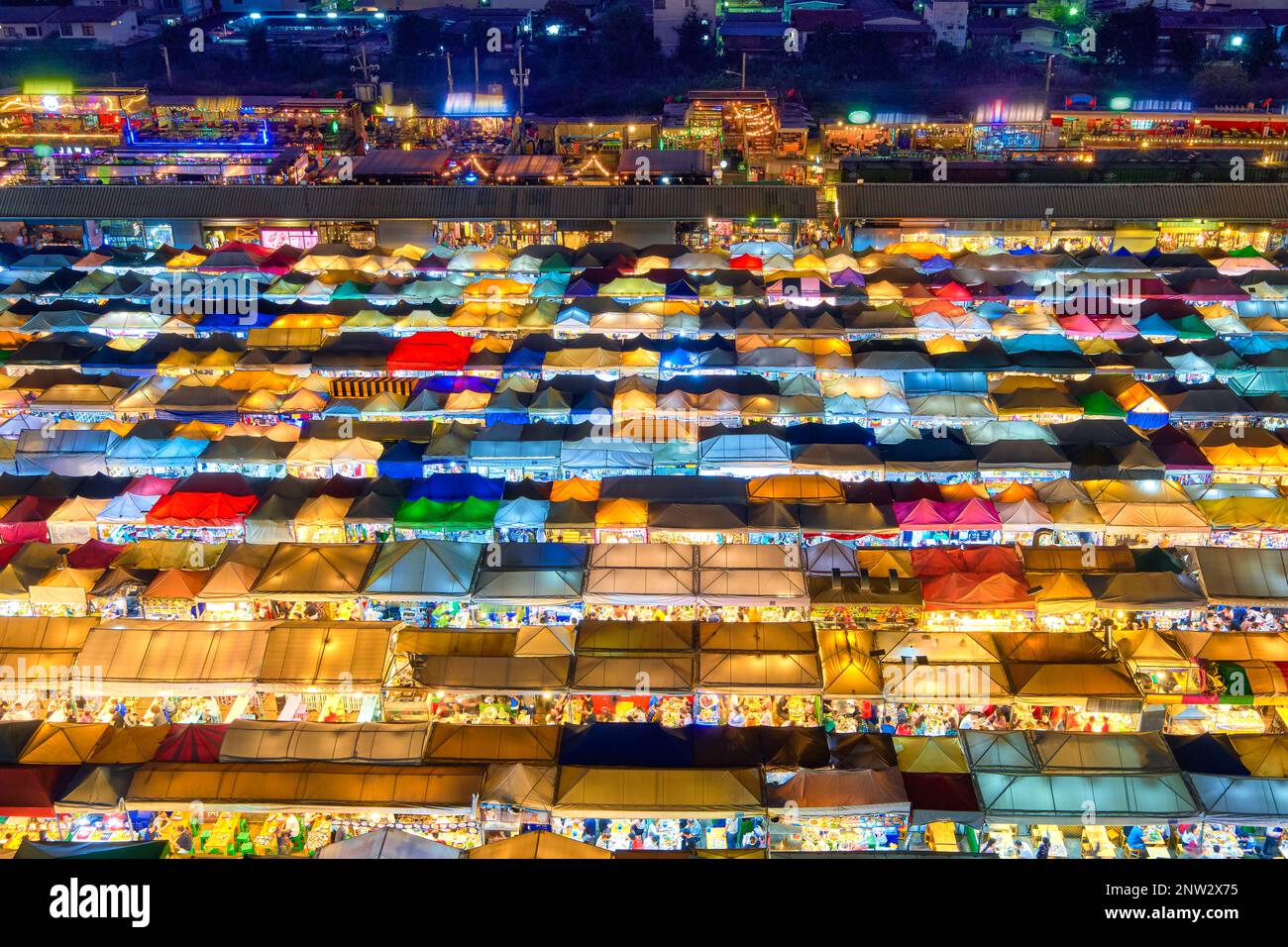Colorful rows of outdoor market tents and food stalls at night, Asia ...