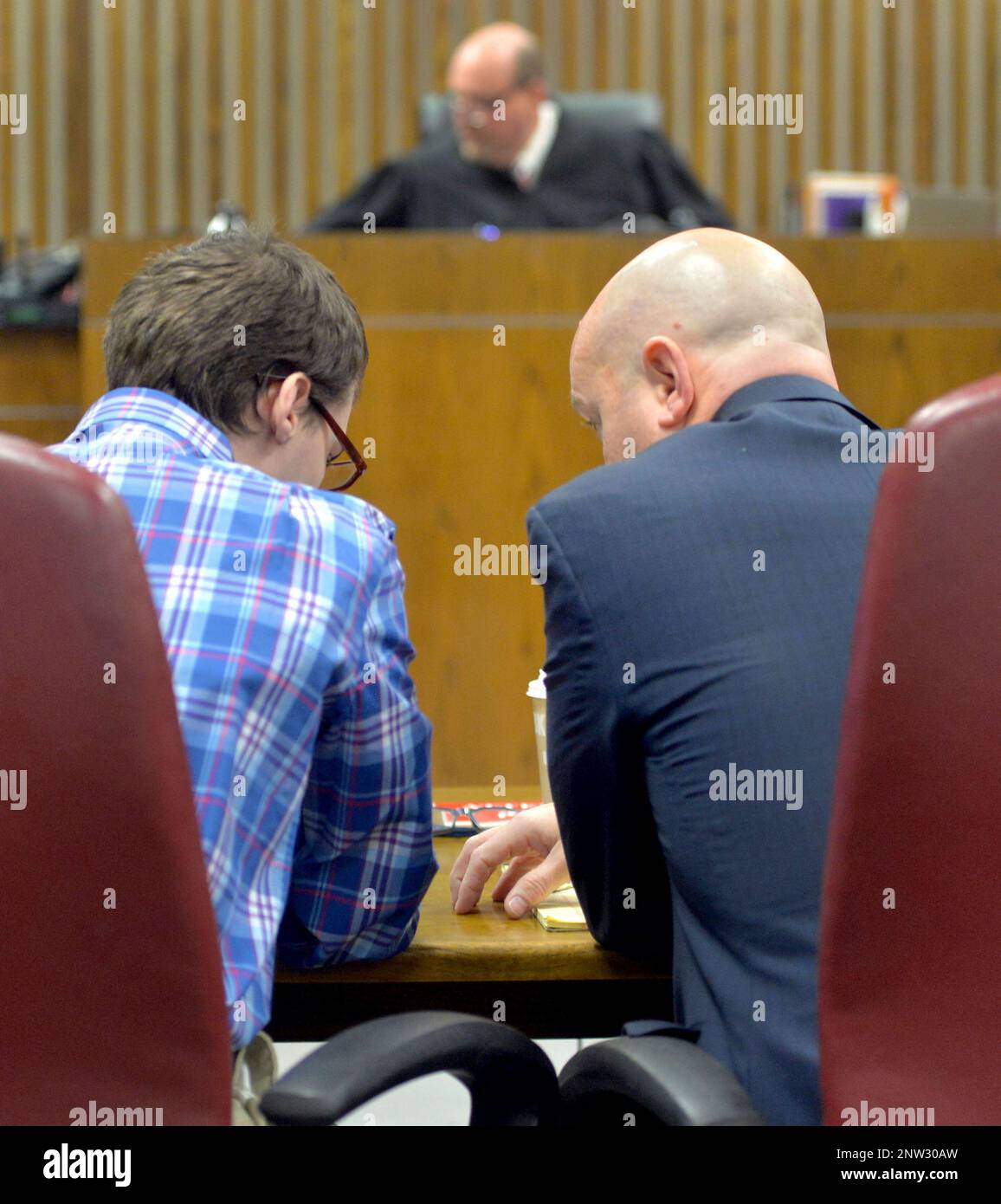 Robert Seth Denton, left, talks with his attorney, Ricky A.W. Curtis ...