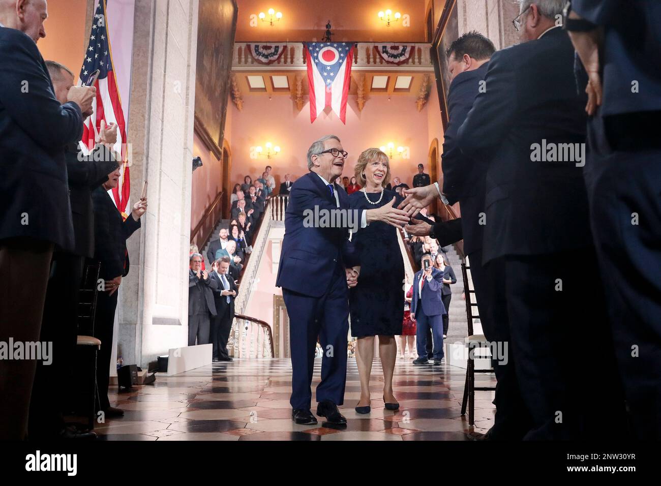 Ohio Governor Mike DeWine, center left, and his wife Fran walk into the ...