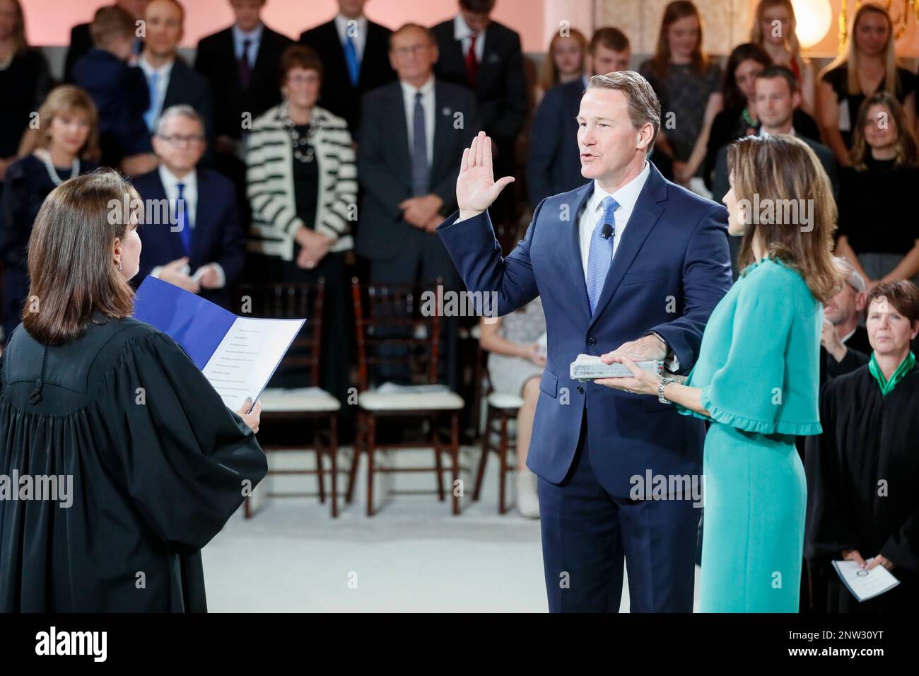 Ohio Lt. Governor John Husted takes the oath of office alongside his ...