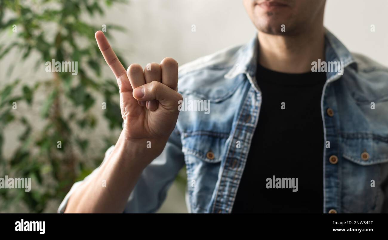Adult Learning Sign Language For Deaf Disabled Stock Photo - Alamy