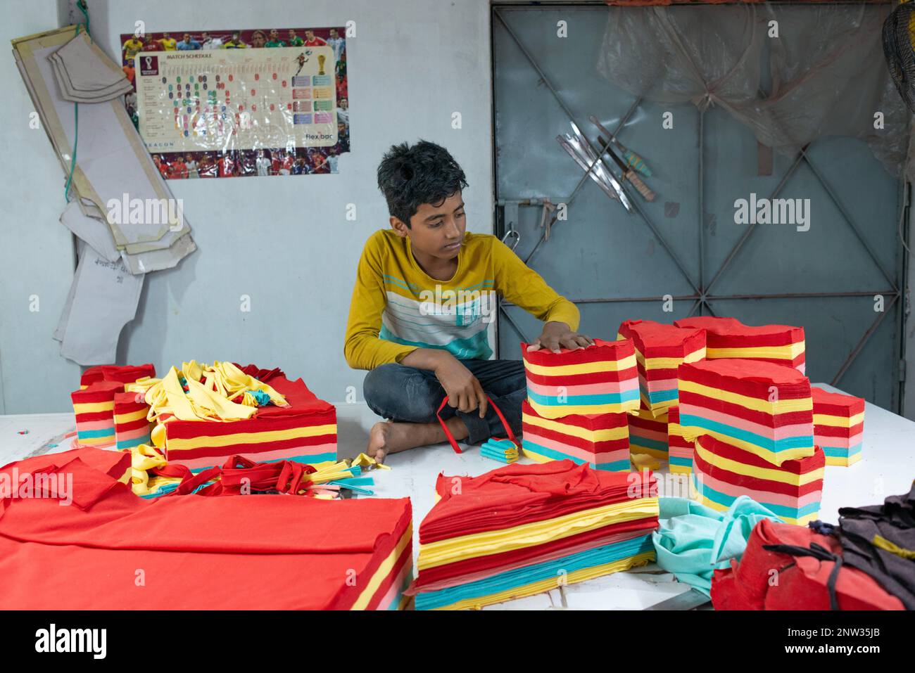 Dhaka, Bangladesh. 28th Feb, 2023. A kid working in a local garment ...