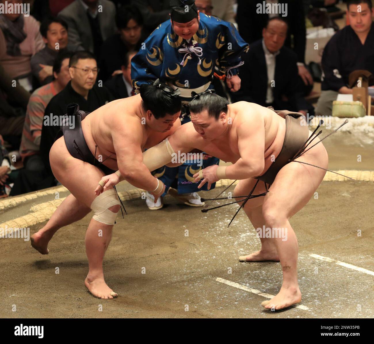 Yokozuna Hakuho (R) beats Komusubi Myogiryu during the first day of ...
