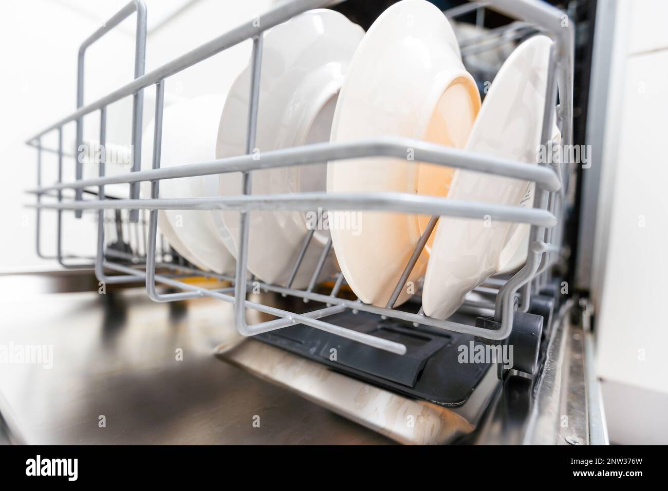 dishwasher close-up with washed dishes, easy to use and save water, eco ...