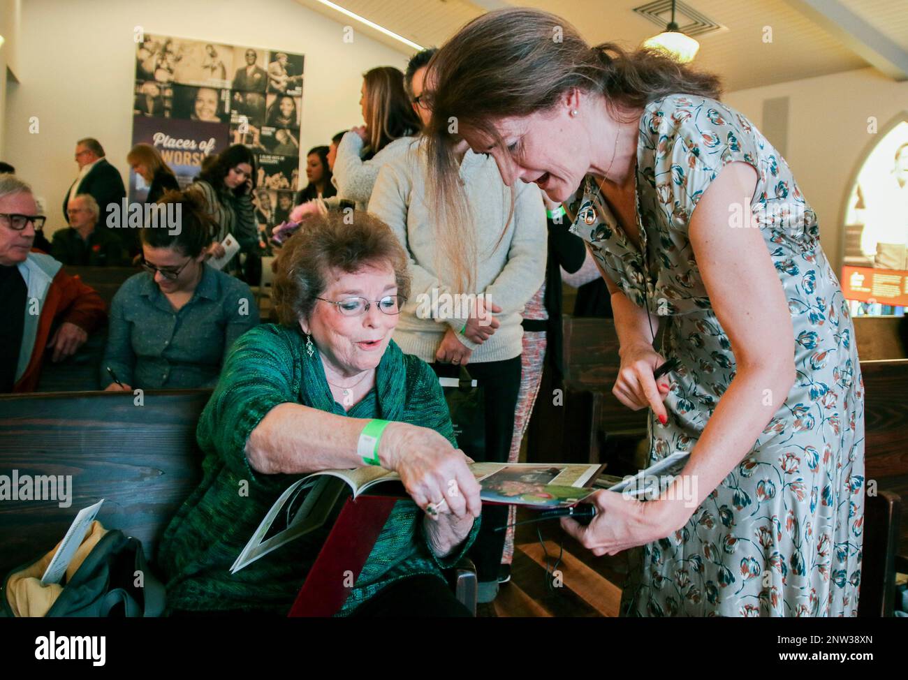 Margaret Remy shows her collection of muppet photographs to Jim Henson ...