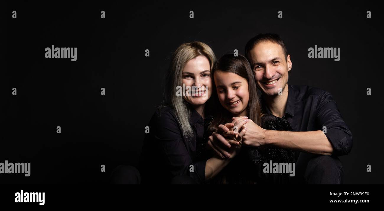 family on a black background Stock Photo - Alamy