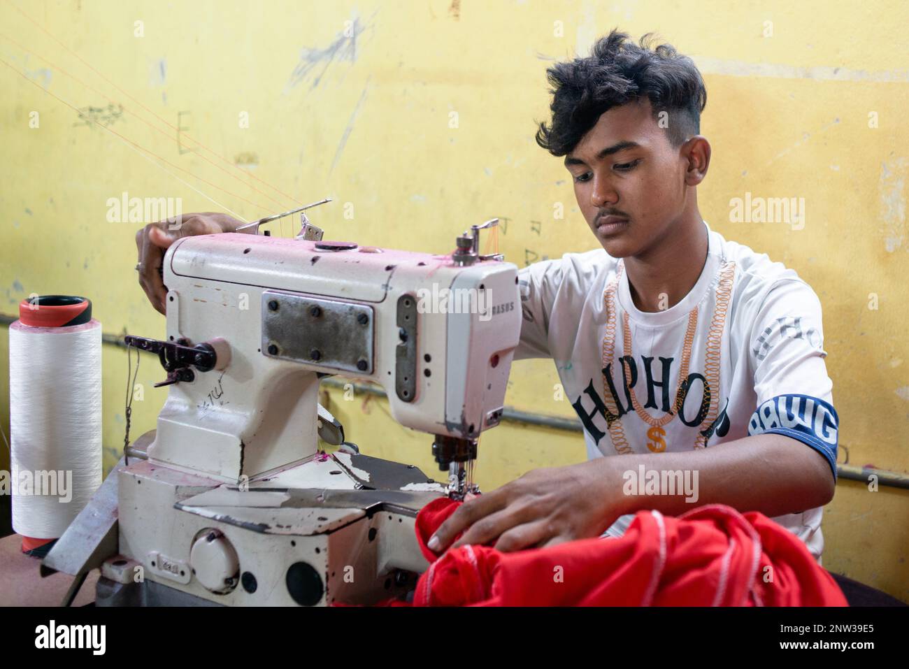 Child garment labour hi-res stock photography and images - Alamy