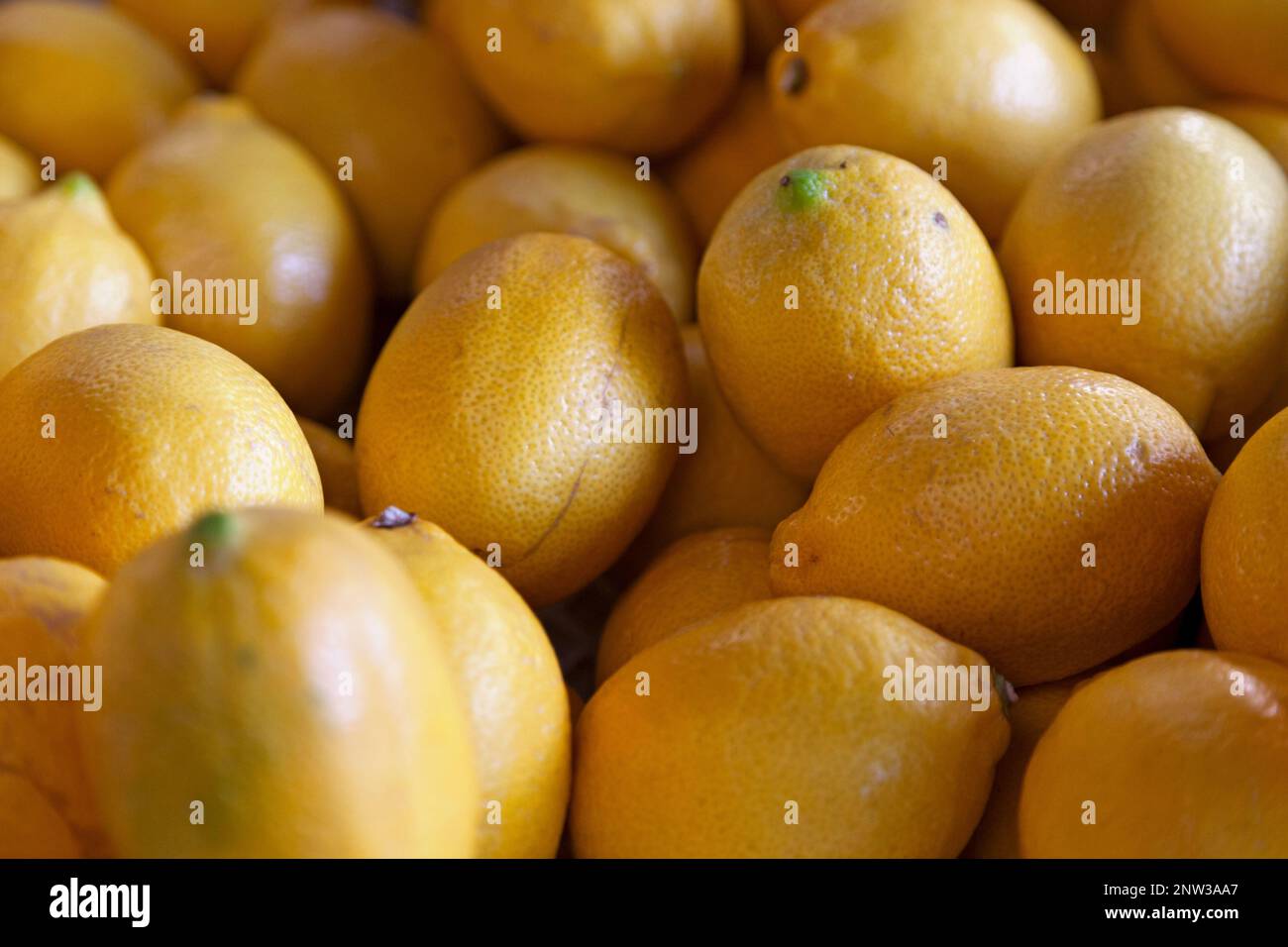 Close-up on a stack of lemons for sale on a market stall Stock Photo ...