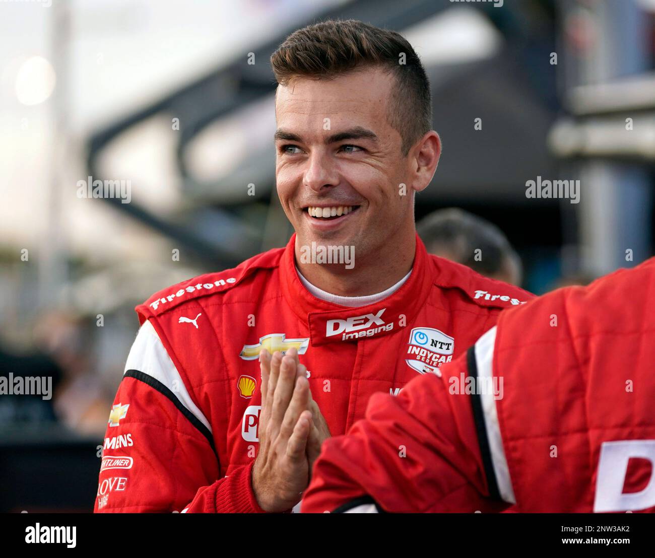 FILE - Scott McLaughlin smiles before an IndyCar auto race at World ...
