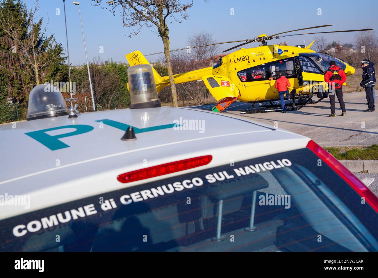 Local police car and Italian Medical helicopter Airbus H145 (HORUS-1) I ...
