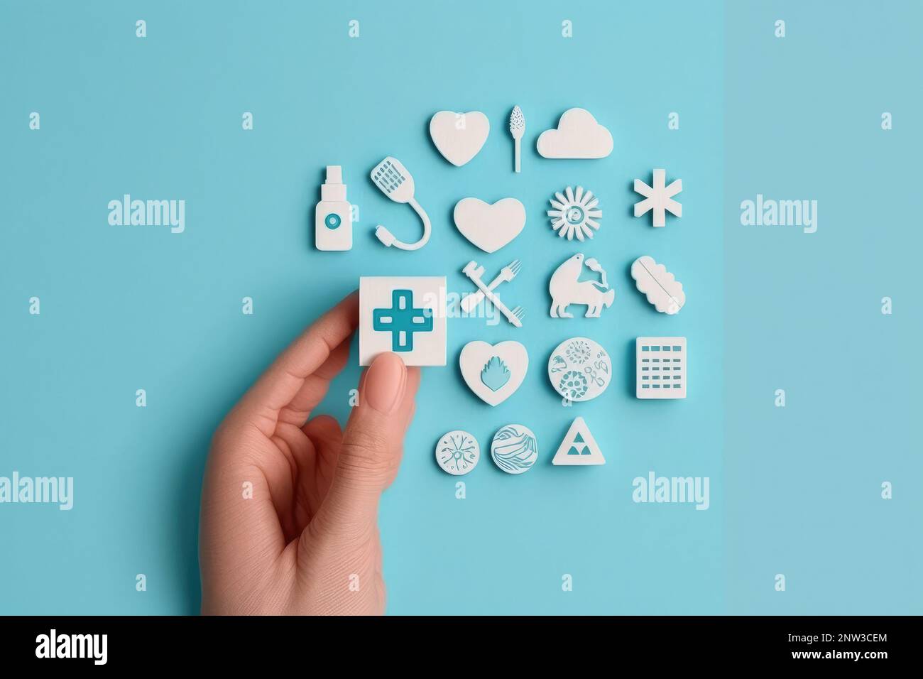 White health symbols on a blue background with human hand picking up ...