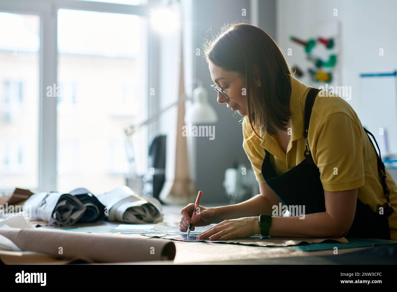 Woman bending over table hi-res stock photography and images - Alamy
