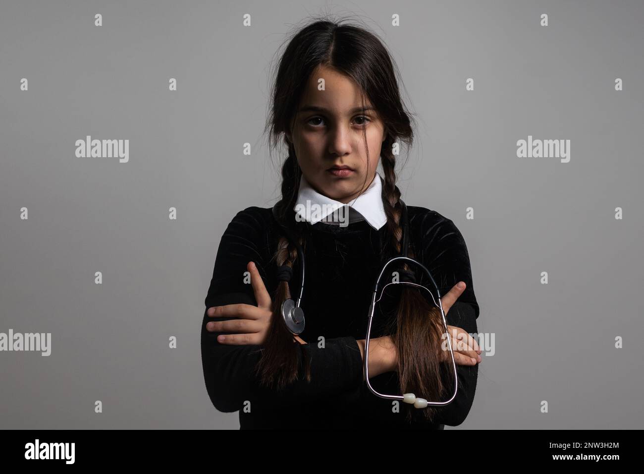 Wednesday Addams. Angry girl student Stock Photo - Alamy