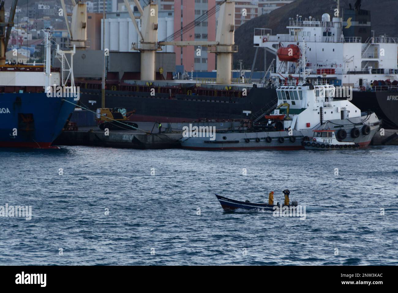Small boat passing larger boat hi-res stock photography and images - Alamy