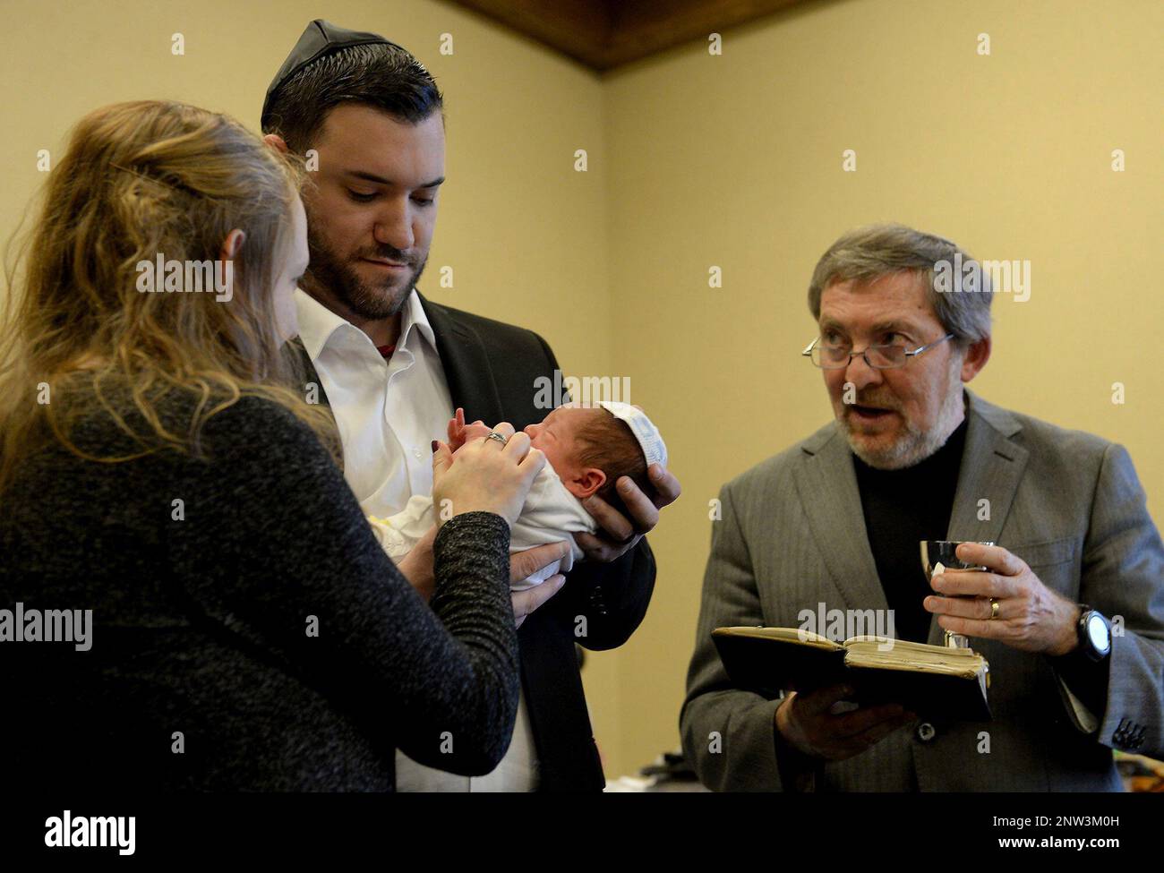 As part of the ceremony following the circumcision, Rabbi Victor Urecki ...