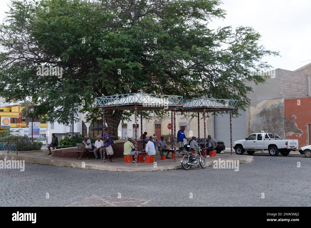 Porto Grande Outdoor recreation area. Card Games, Socializing seated on ...