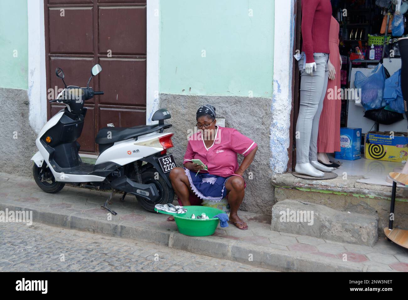 Trading Lady on the street in Porto Grande. Selling her catch of fresh ...