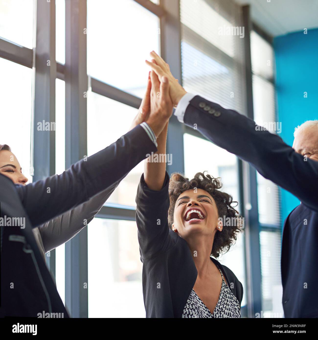 Be bold in the pursuit of success. Shot of a group of colleagues giving ...