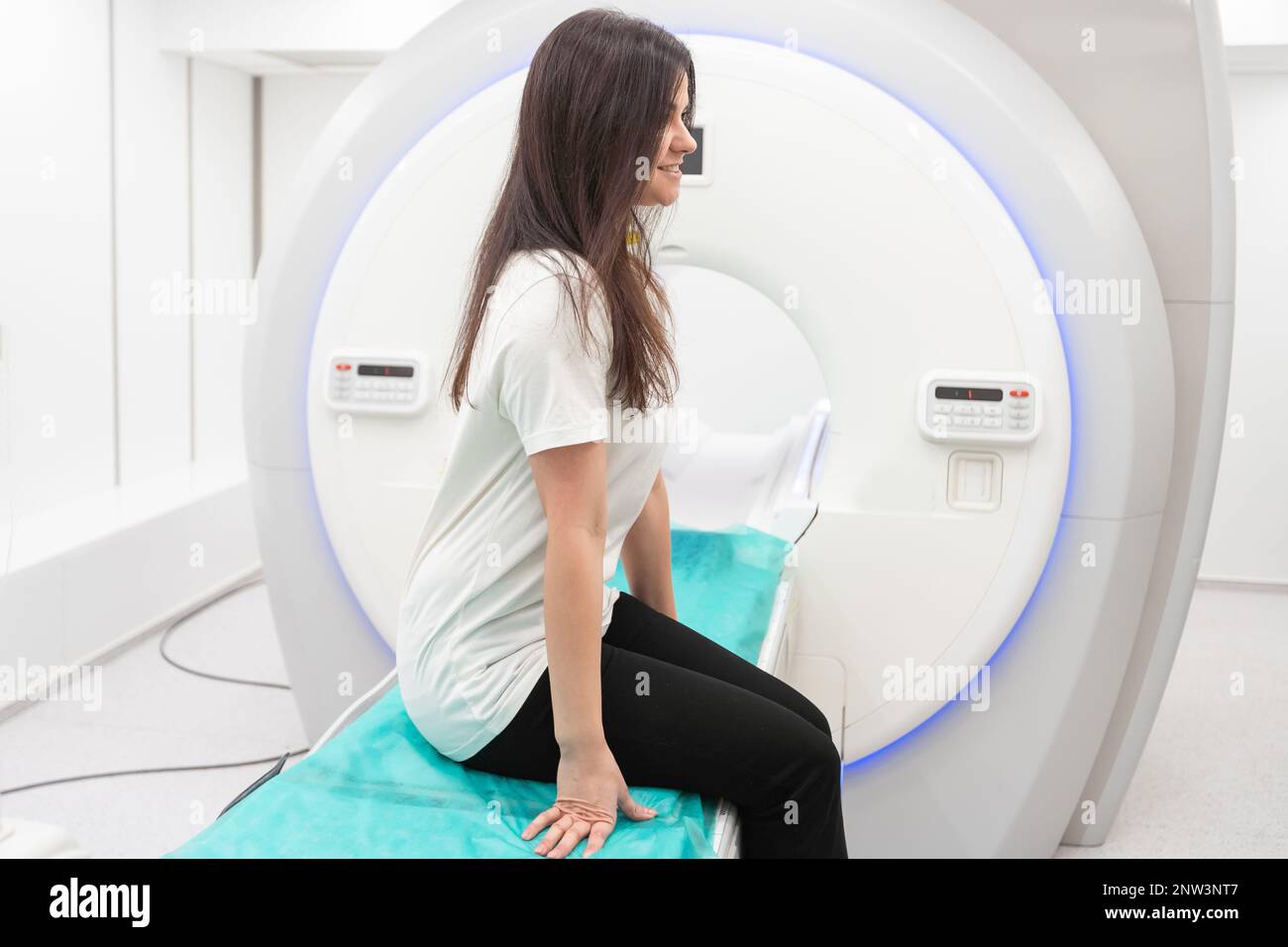 Female patient undergoing MRI - Magnetic resonance imaging in Hospital ...