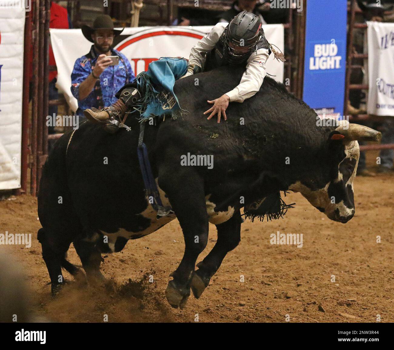 Nathan Hatchel of Weatherford, OK.,competes in bull riding at Ector ...