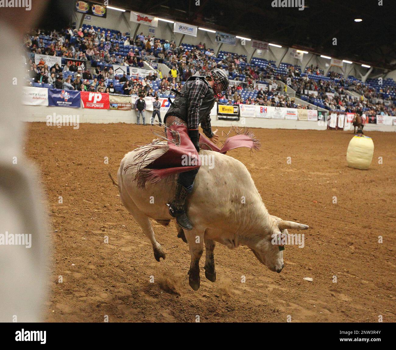 J. T. Pettitt competes in bull riding during the SandHills Stock Show ...