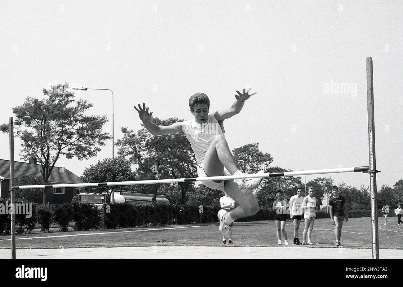1989, historical, school sports, a teenage boy doing the high jump ...