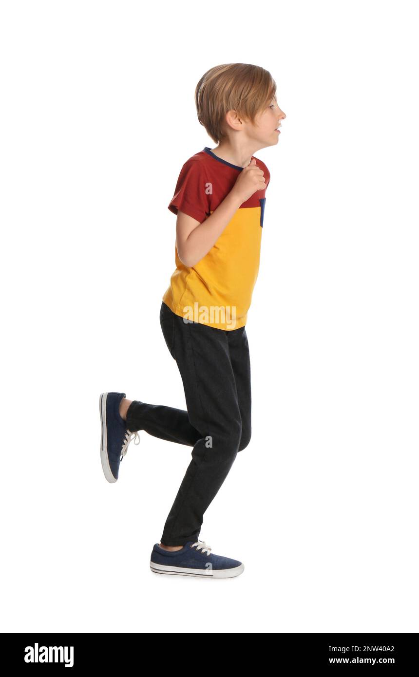 Cute little boy running on white background Stock Photo - Alamy