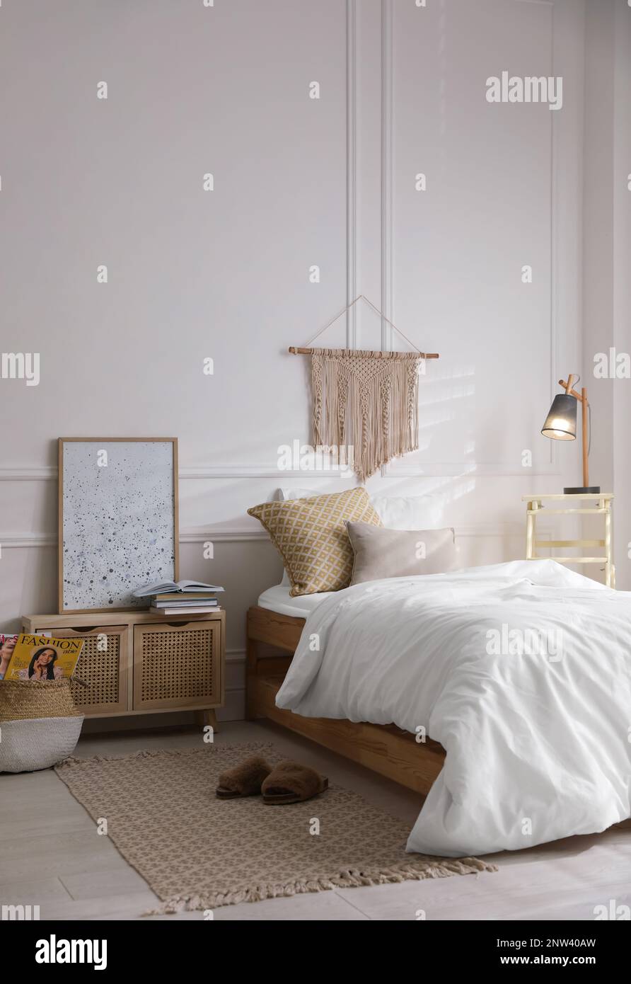 Comfortable bed with clean white linens indoors Stock Photo - Alamy