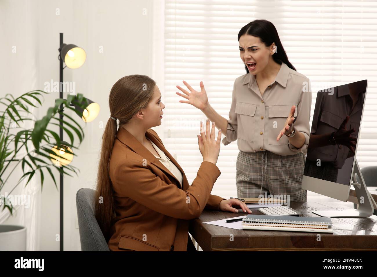 Boss screaming at employee in office. Toxic work environment Stock ...