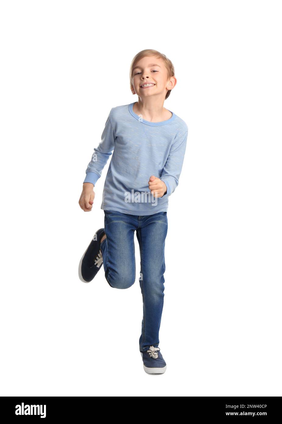 Cute little boy running on white background Stock Photo - Alamy