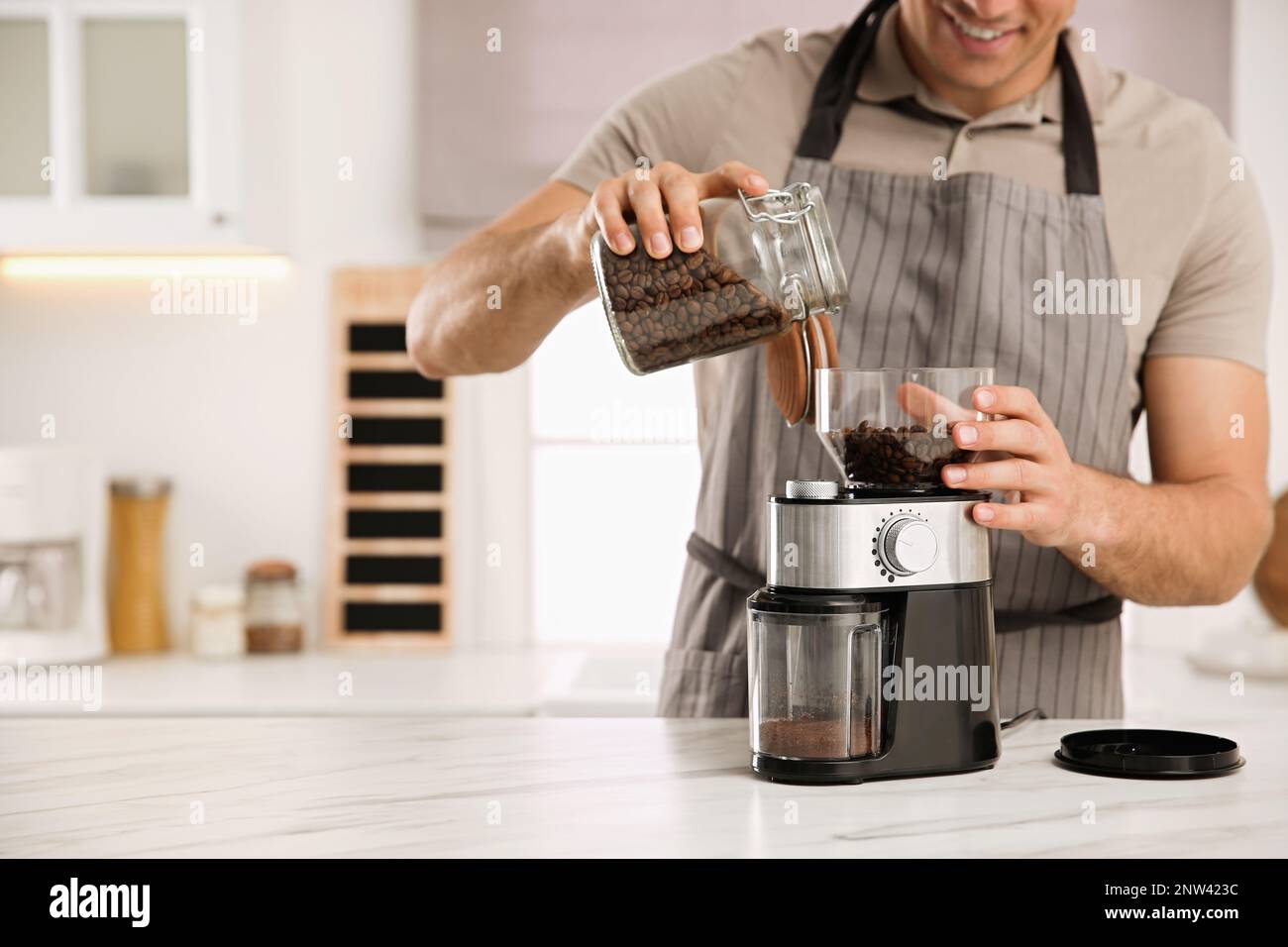 Man using electric coffee hi-res stock photography and images - Alamy