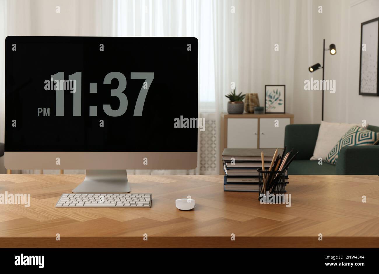 Comfortable workplace with modern computer on wooden desk in room ...