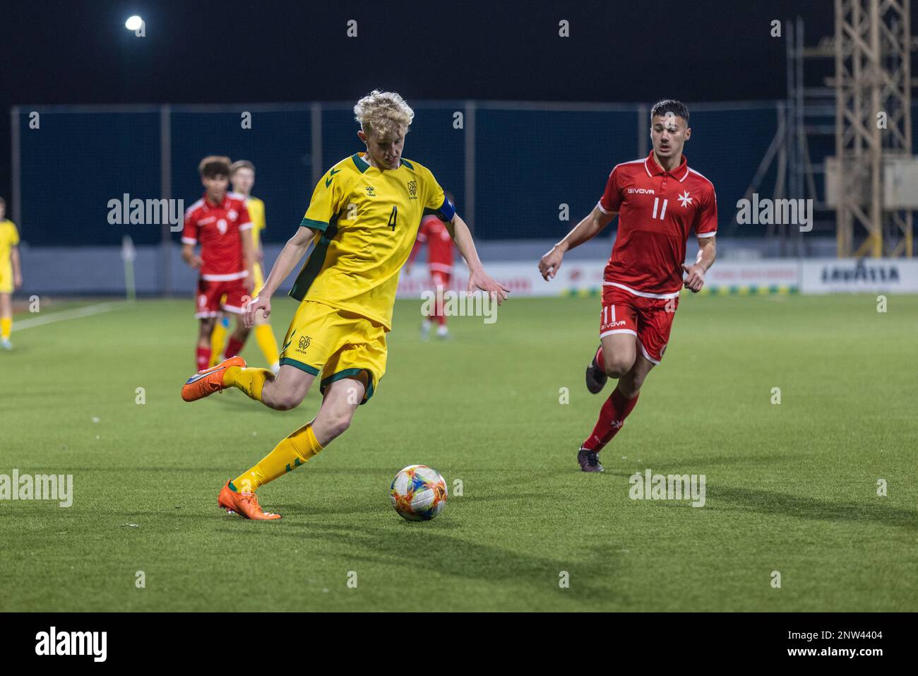 Young football player attacks the goal Stock Photo - Alamy