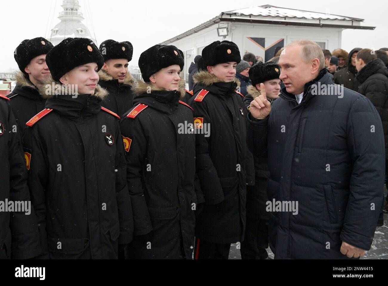Russian President Vladimir Putin, right, gestures while speaking to ...