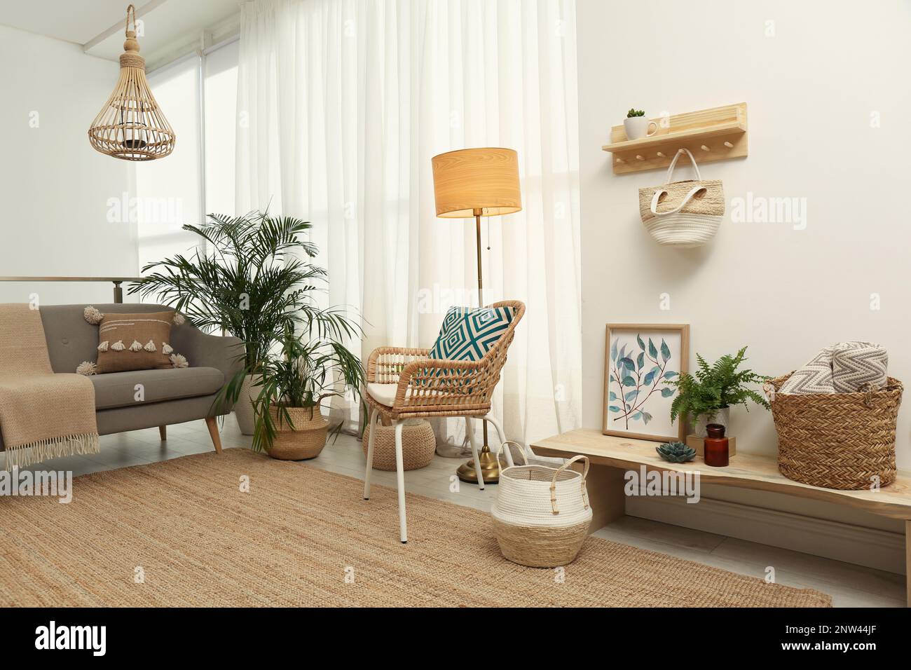 Light living room with boho decor. Interior design Stock Photo - Alamy