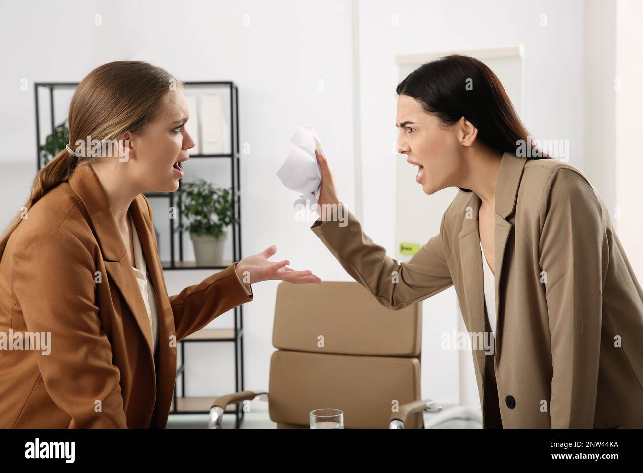 Emotional colleagues arguing in office. Toxic work environment Stock ...