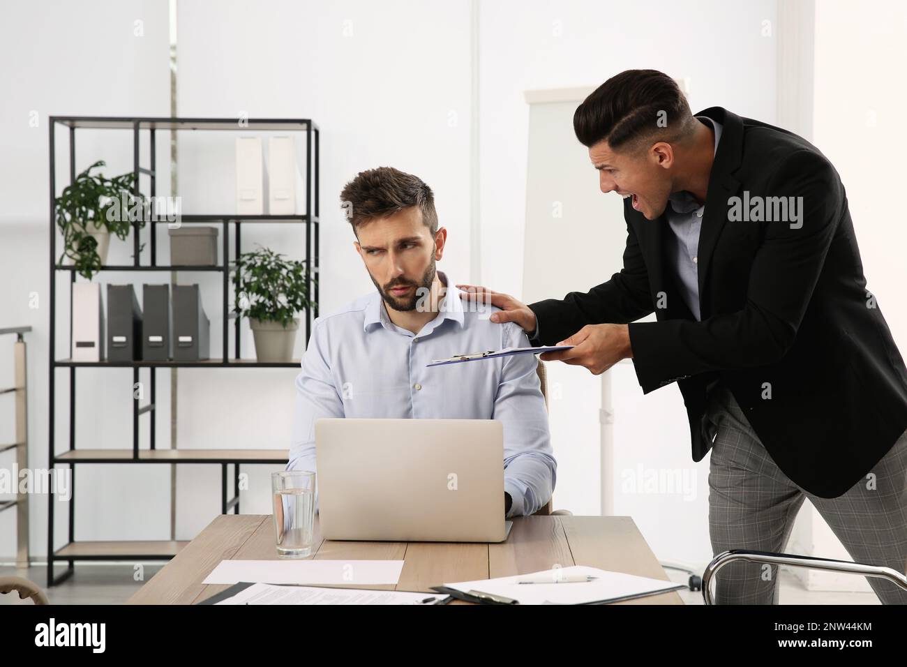 Boss screaming at employee in office. Toxic work environment Stock ...