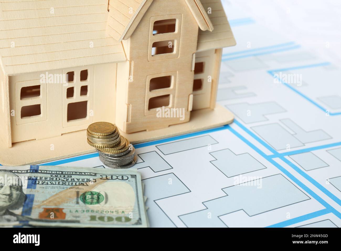 Money and house model on cadastral map, closeup Stock Photo - Alamy