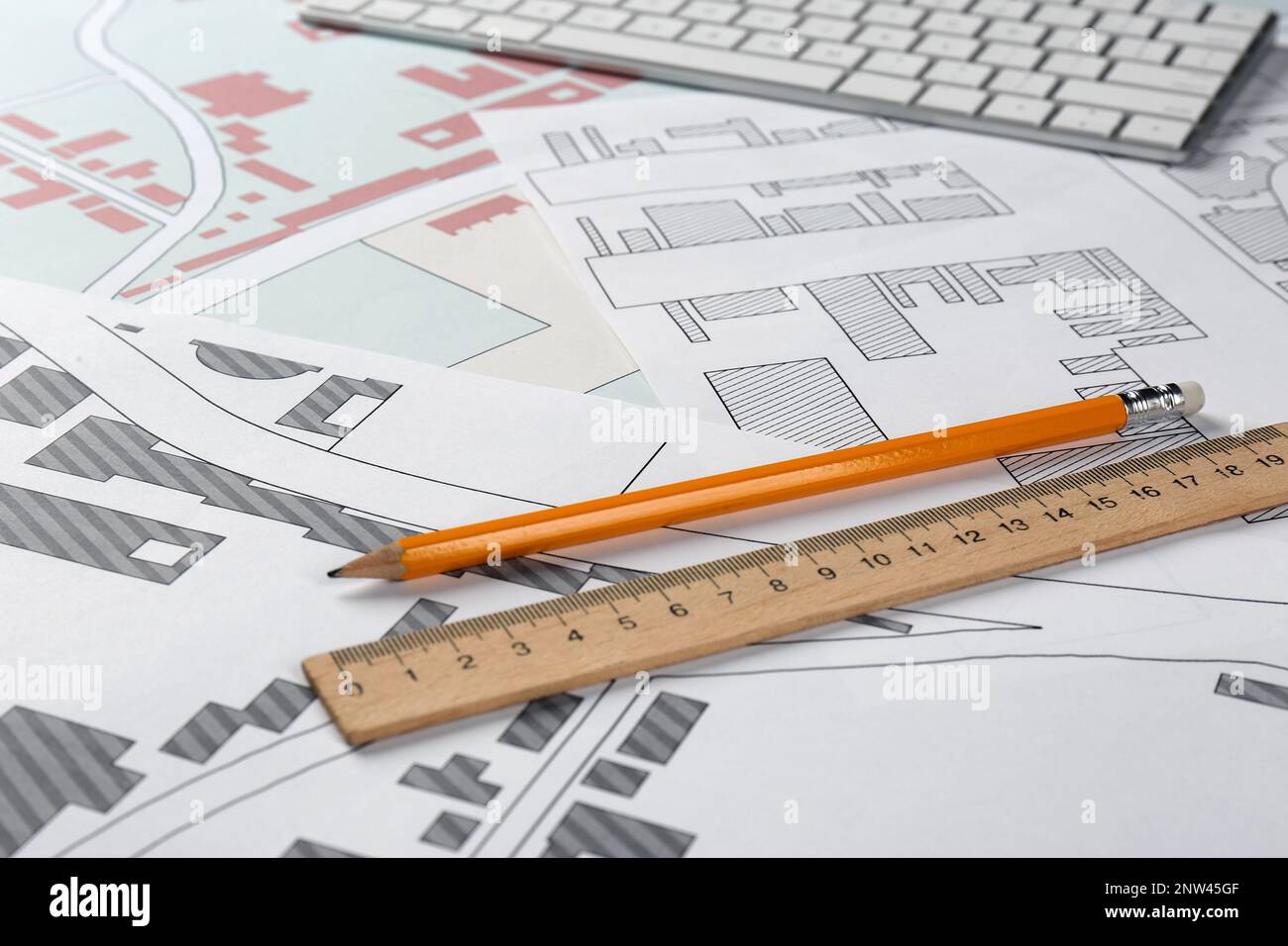 Pencil and ruler on cadastral maps of territory with buildings Stock ...