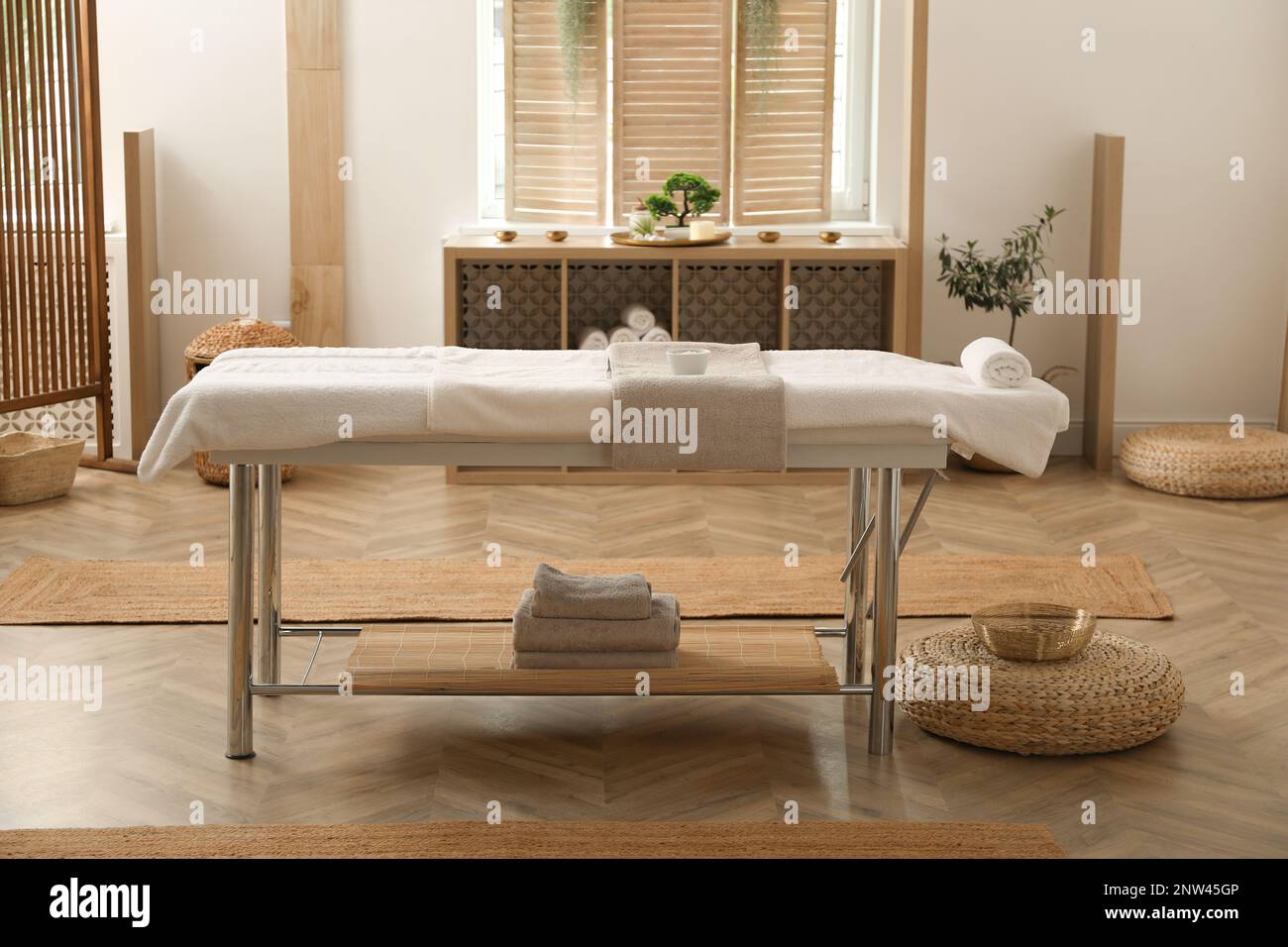 Stylish massage room interior with spa table in salon Stock Photo - Alamy
