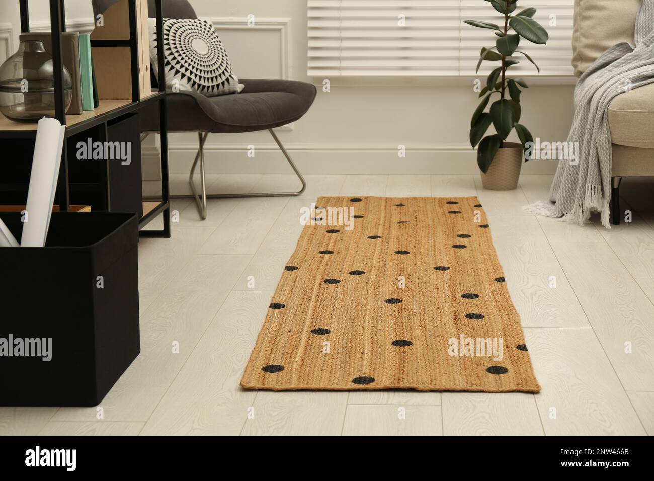 Stylish room interior with modern furniture and wicker runner rug Stock ...