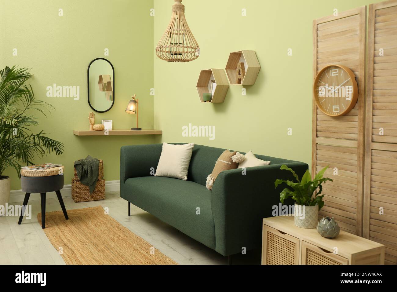 Living room with comfortable green sofa. Interior design Stock Photo ...