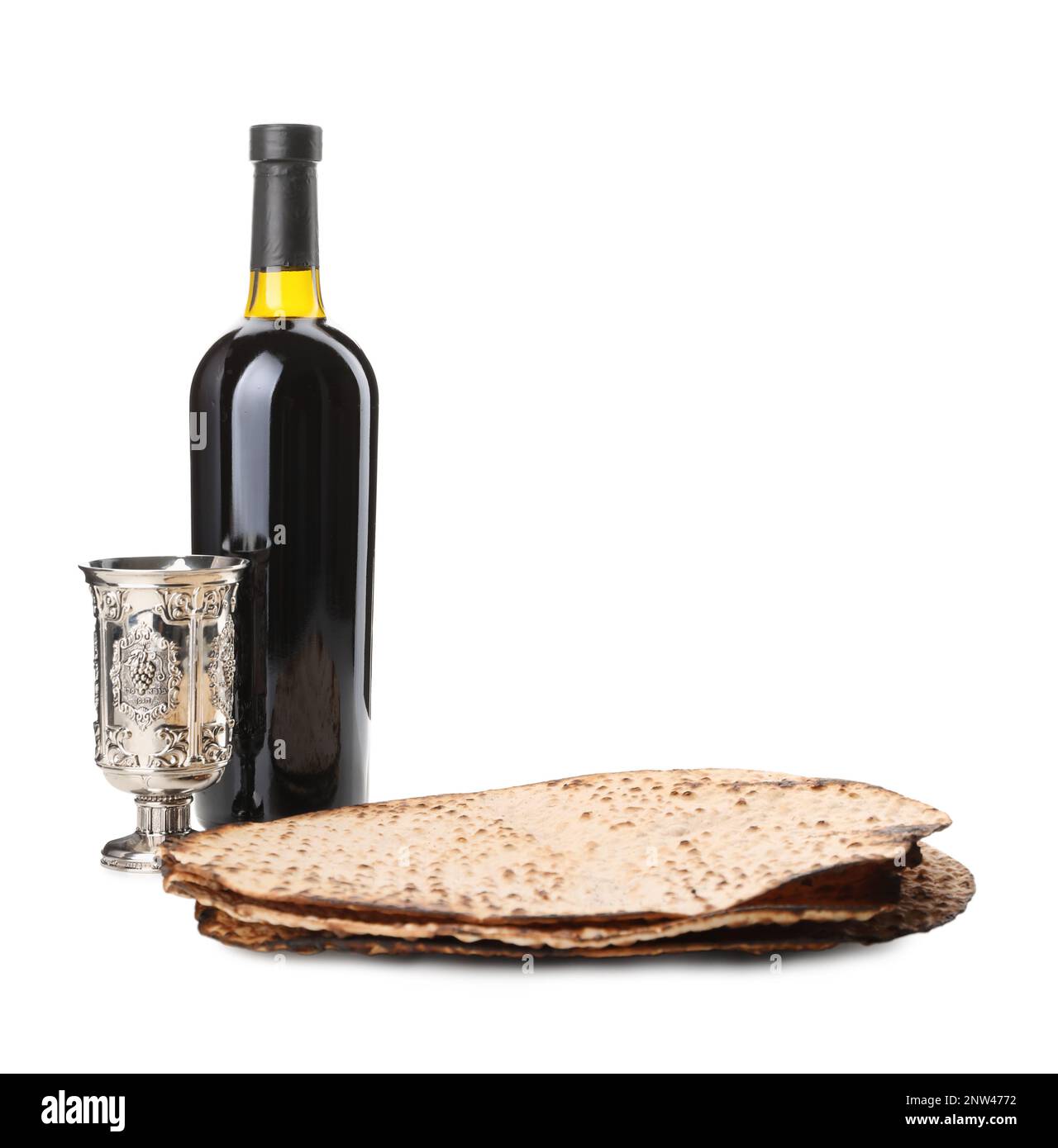 Tasty matzos, wine and goblet on white background. Passover (Pesach ...