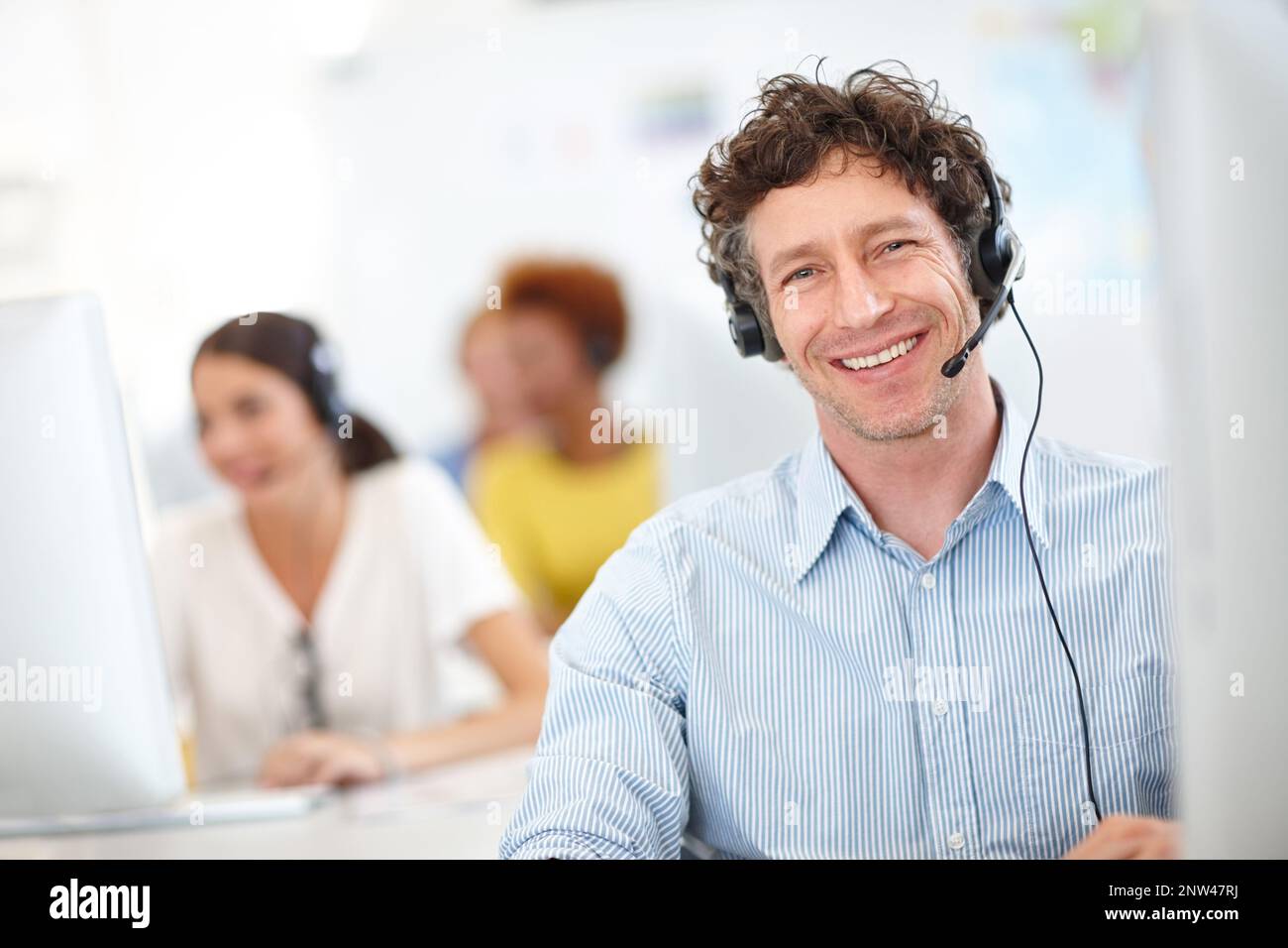 Were the call center you need. Cropped portrait of a handsome call ...